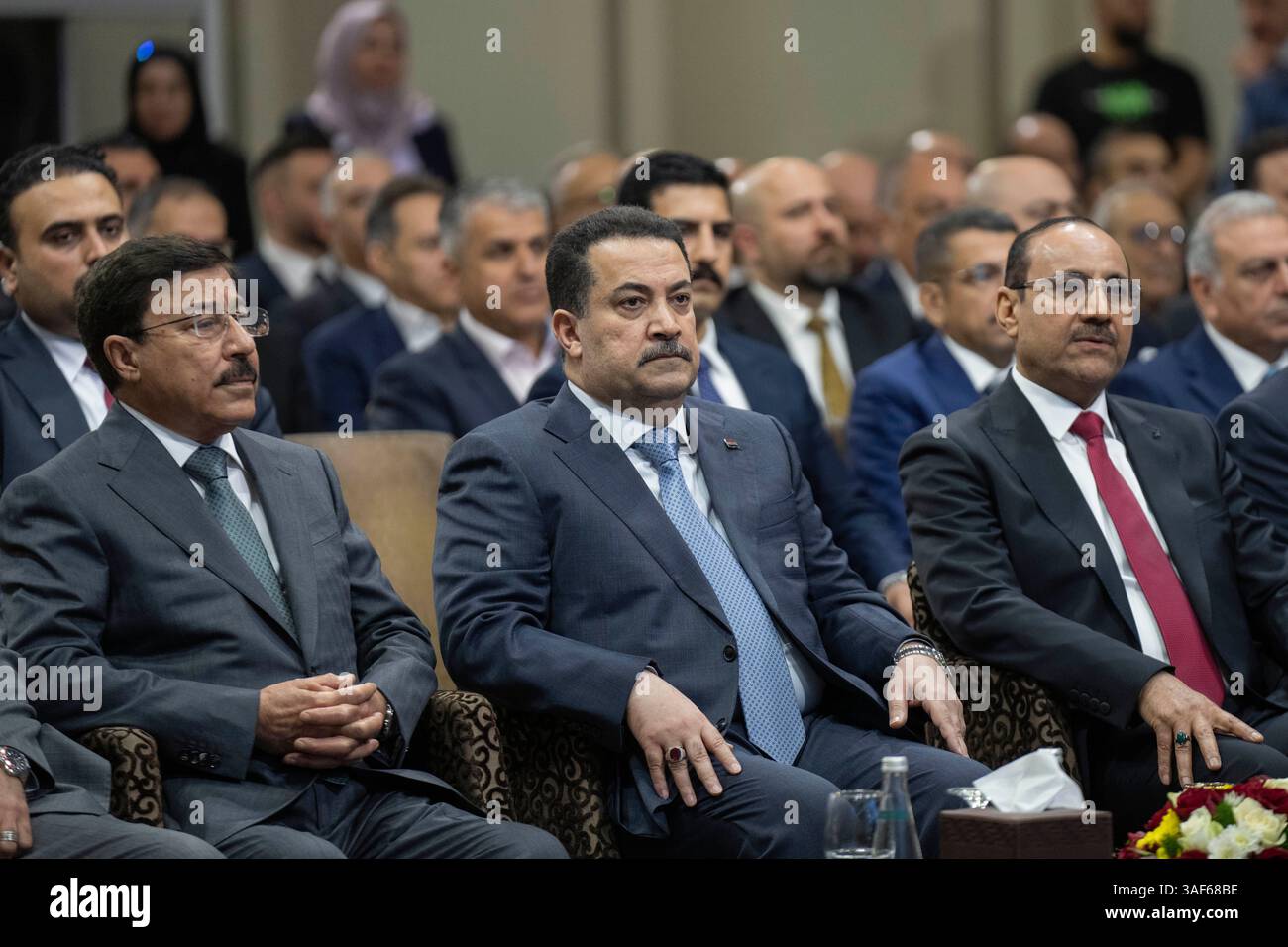 Iraqi Prime Minister Mohammed Shia al-Sudani, center, attends Iraq's ...