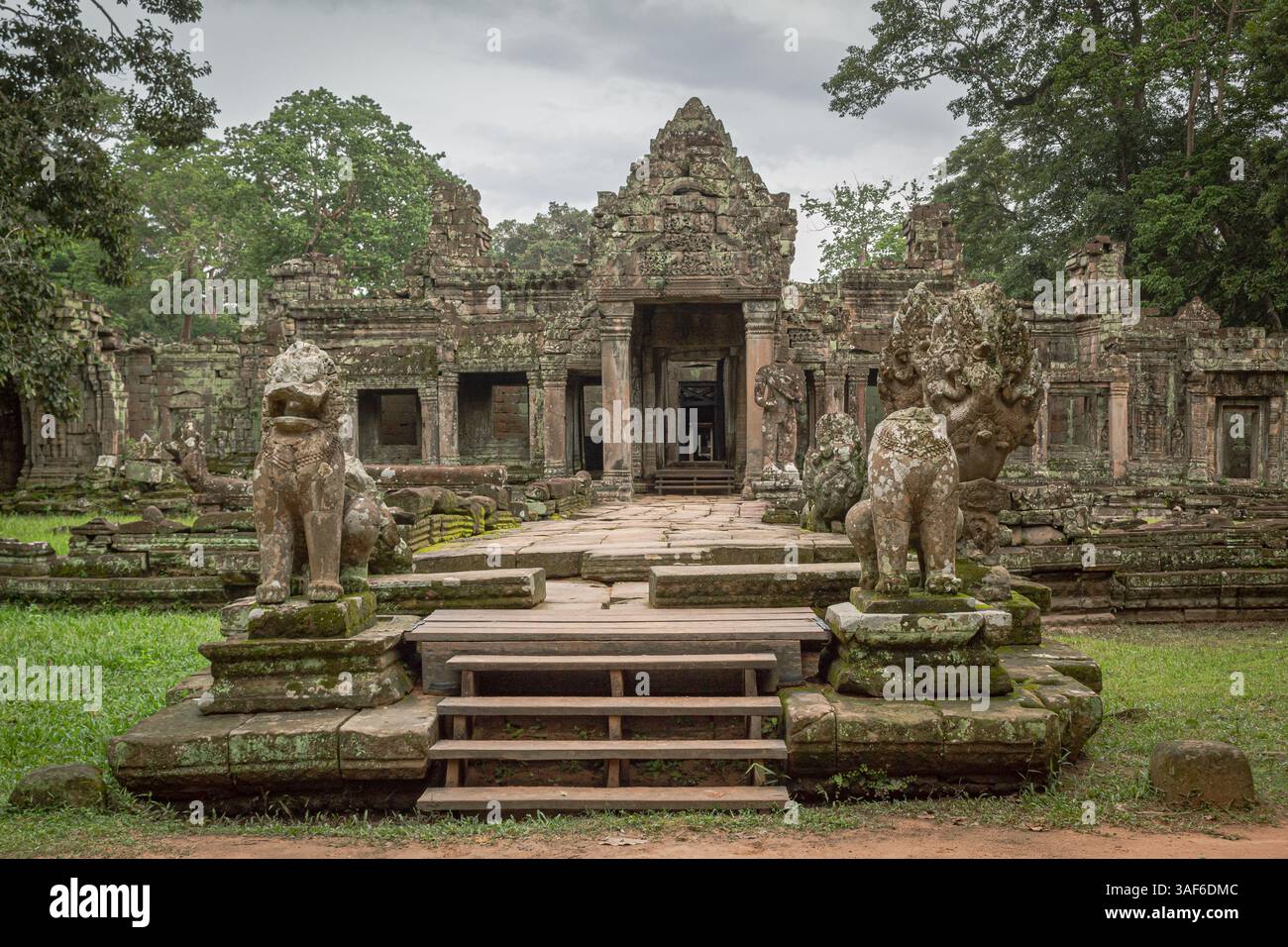 Moss covered green stone exterior design and sacred entrance statues of ...