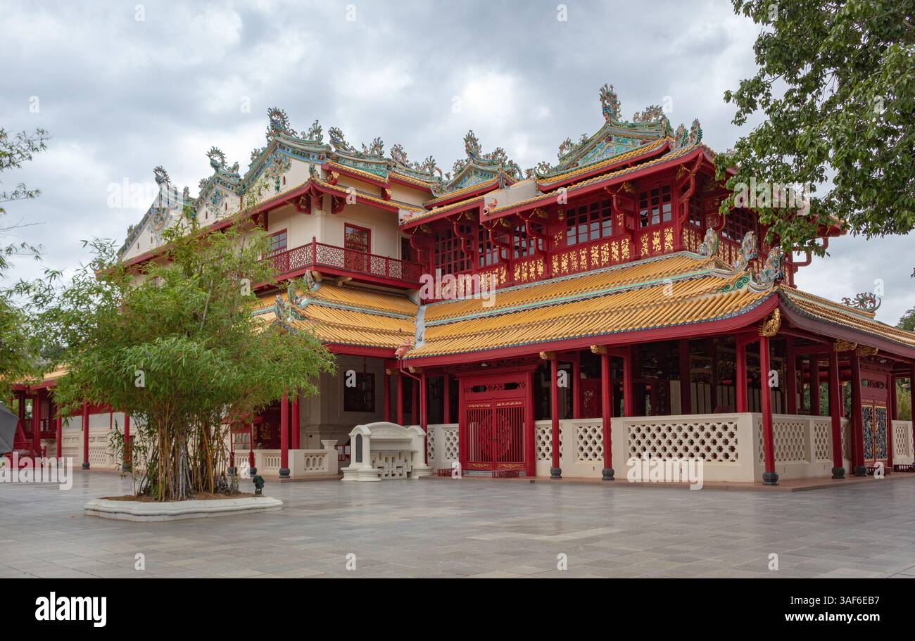 Colorful red and yellow temple building at the gardens of Bang Pa Royal ...