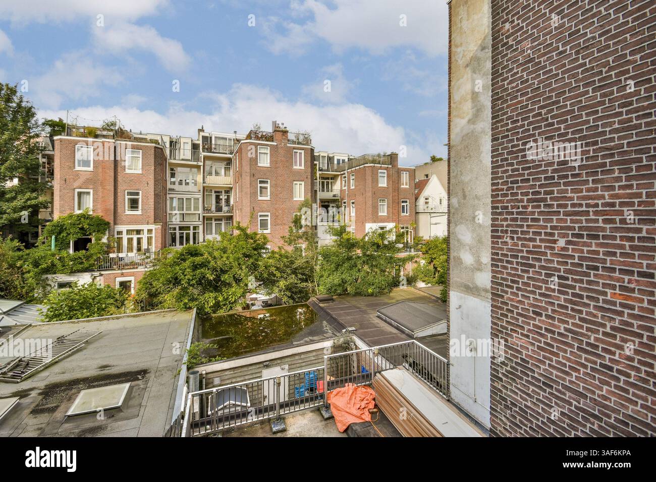A scenic view showcasing a cluster of residential buildings surrounded ...
