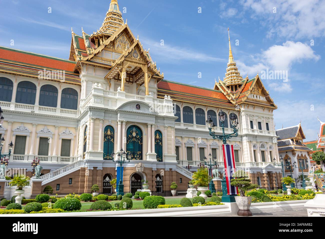 Iconic Grand Palace Throne Hall building and Thai flag located in ...