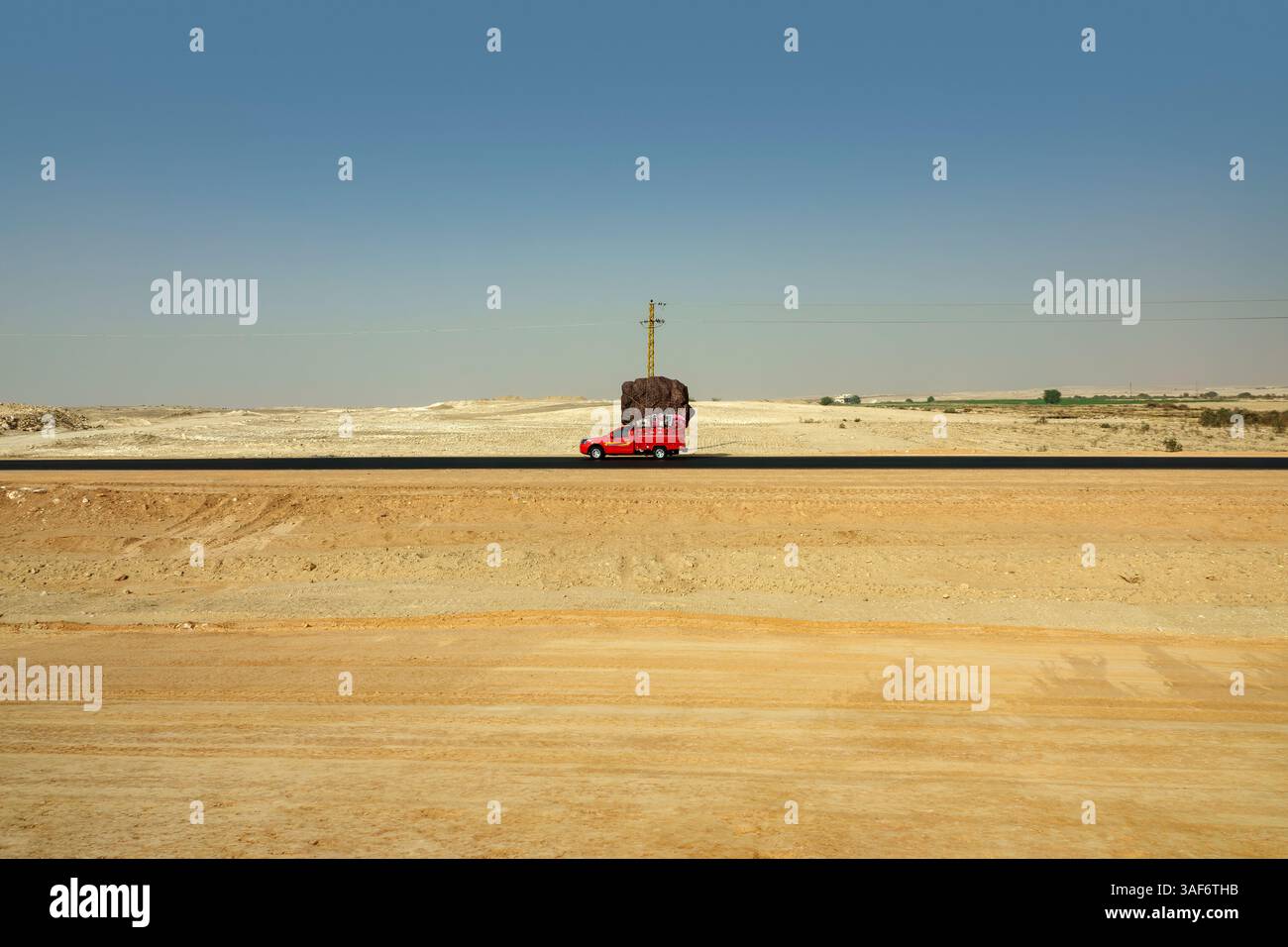 Car on tarmac desert road, Egypt Stock Photo - Alamy