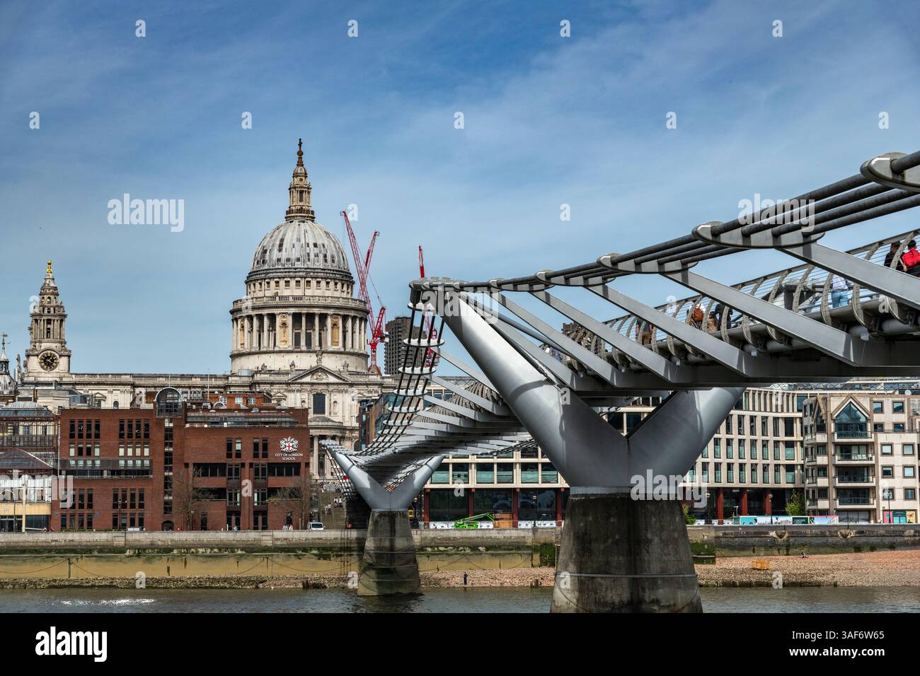 people crossing the millennium bridge Stock Photo - Alamy
