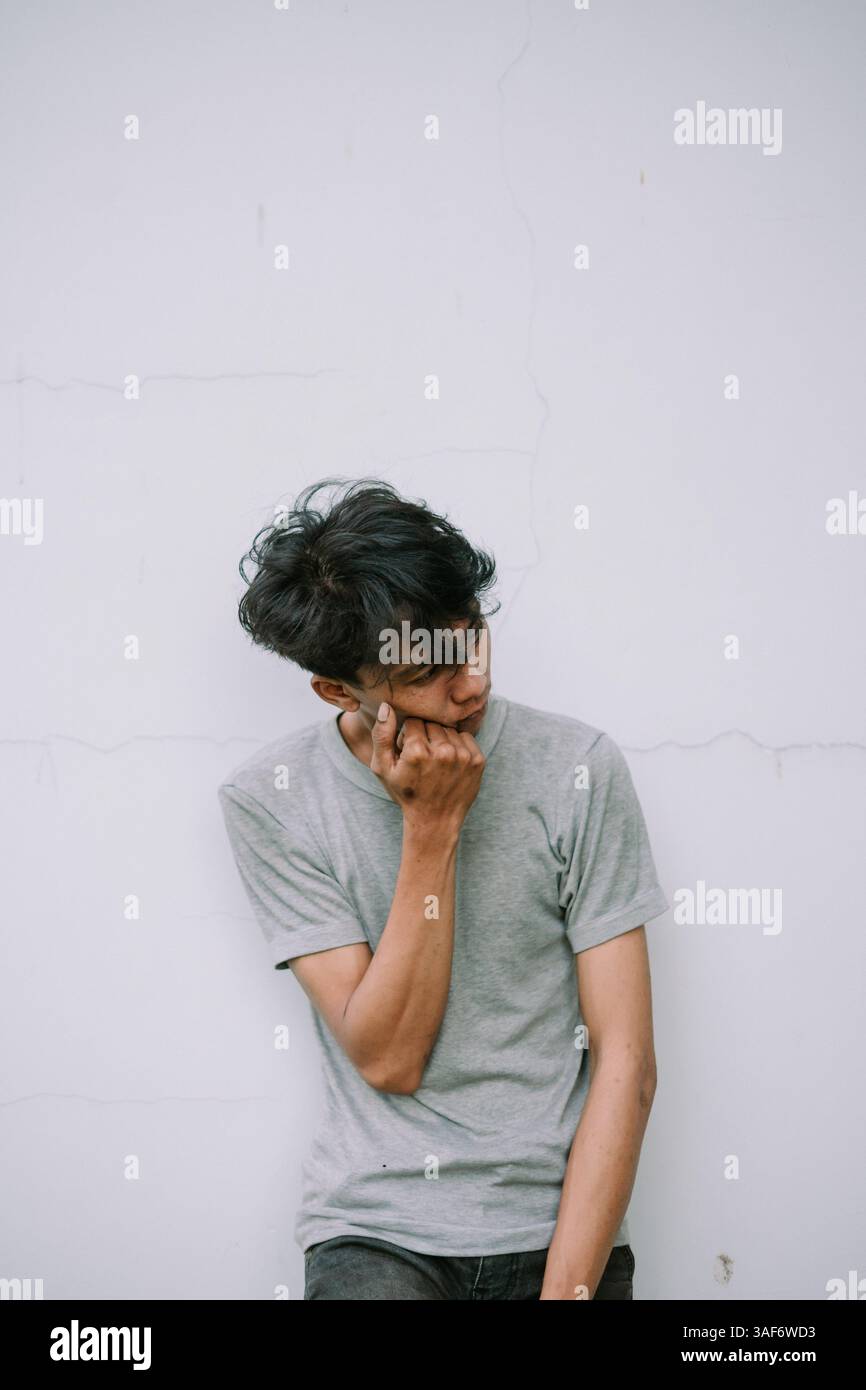 Man in white shirt captures hi-res stock photography and images - Alamy