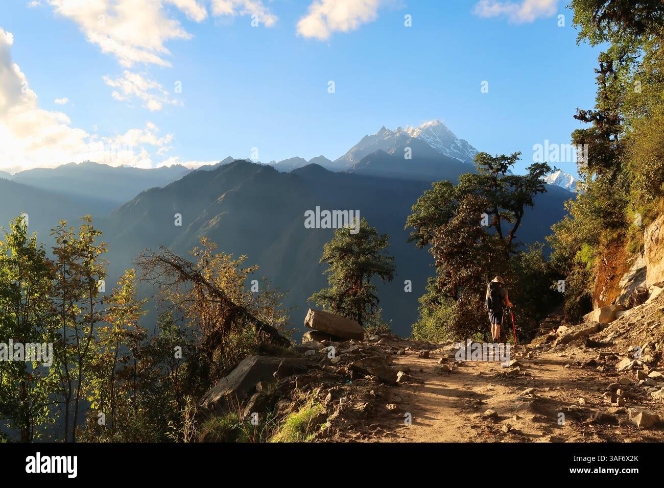 Hiker at golden hour on the trail between Salleri, Phaplu, Bupsa ...