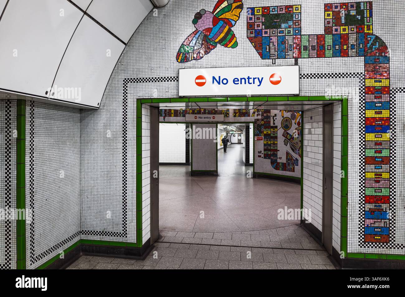 Subway walkway featuring Victoria line signage and wall mosaics. London ...