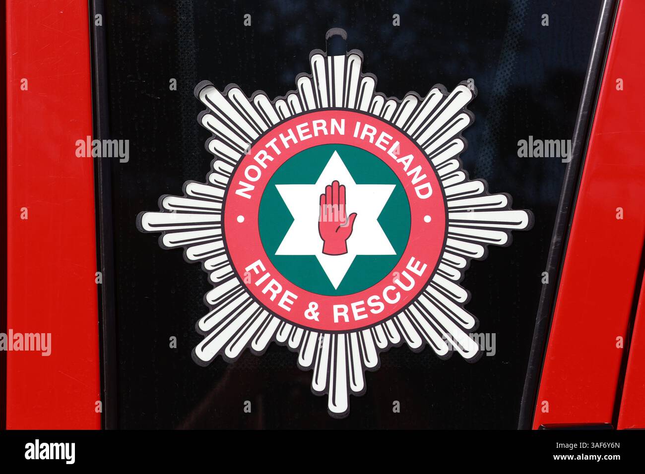 A Northern Ireland Fire and Rescue Service (NIFRS) logo on a fire ...