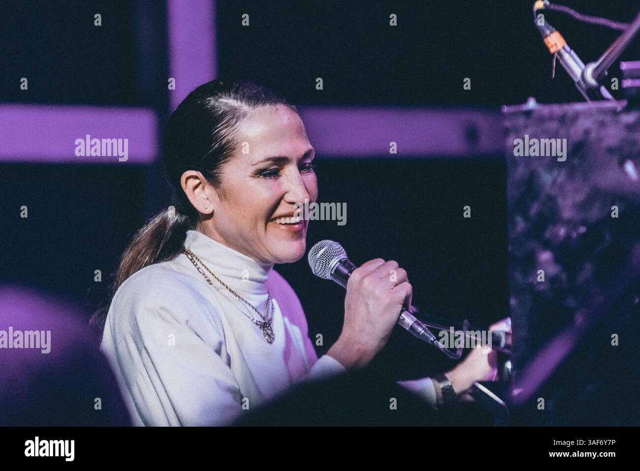 Joan As Police Woman sing and play the piano during Joan As Police ...