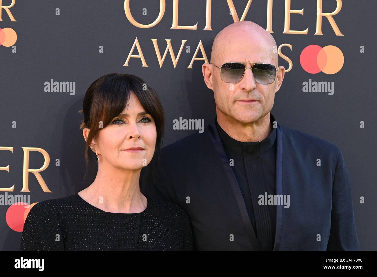 Liza Marshall and Mark Strong attends the 2025 Olivier Awards with ...