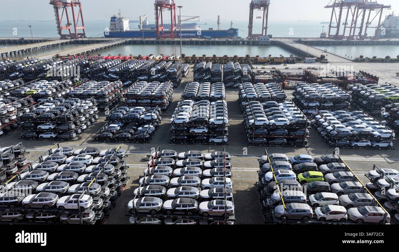 A view of stacks of new cars waiting for shipment to overseas markets ...