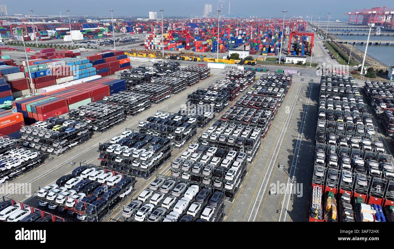 A view of stacks of new cars waiting for shipment to overseas markets ...