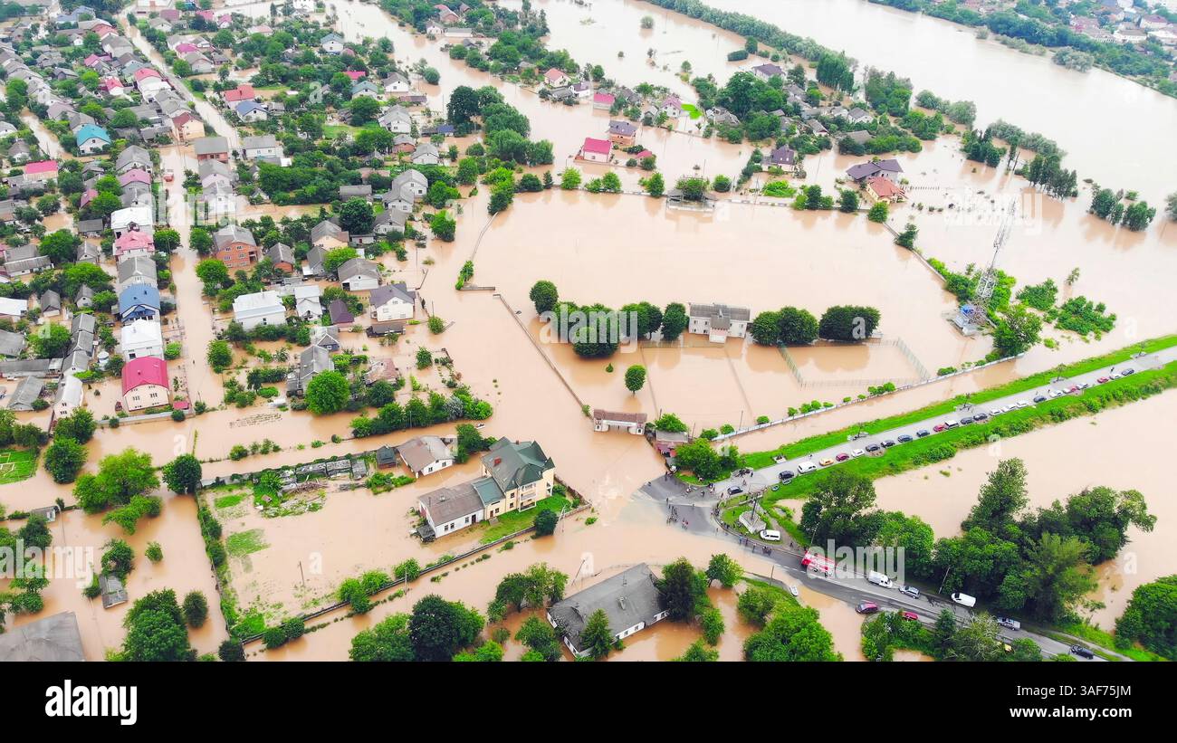 Aerial View of Severe Flooding in Residential Area. Aerial photo capturing extensive flooding in ...