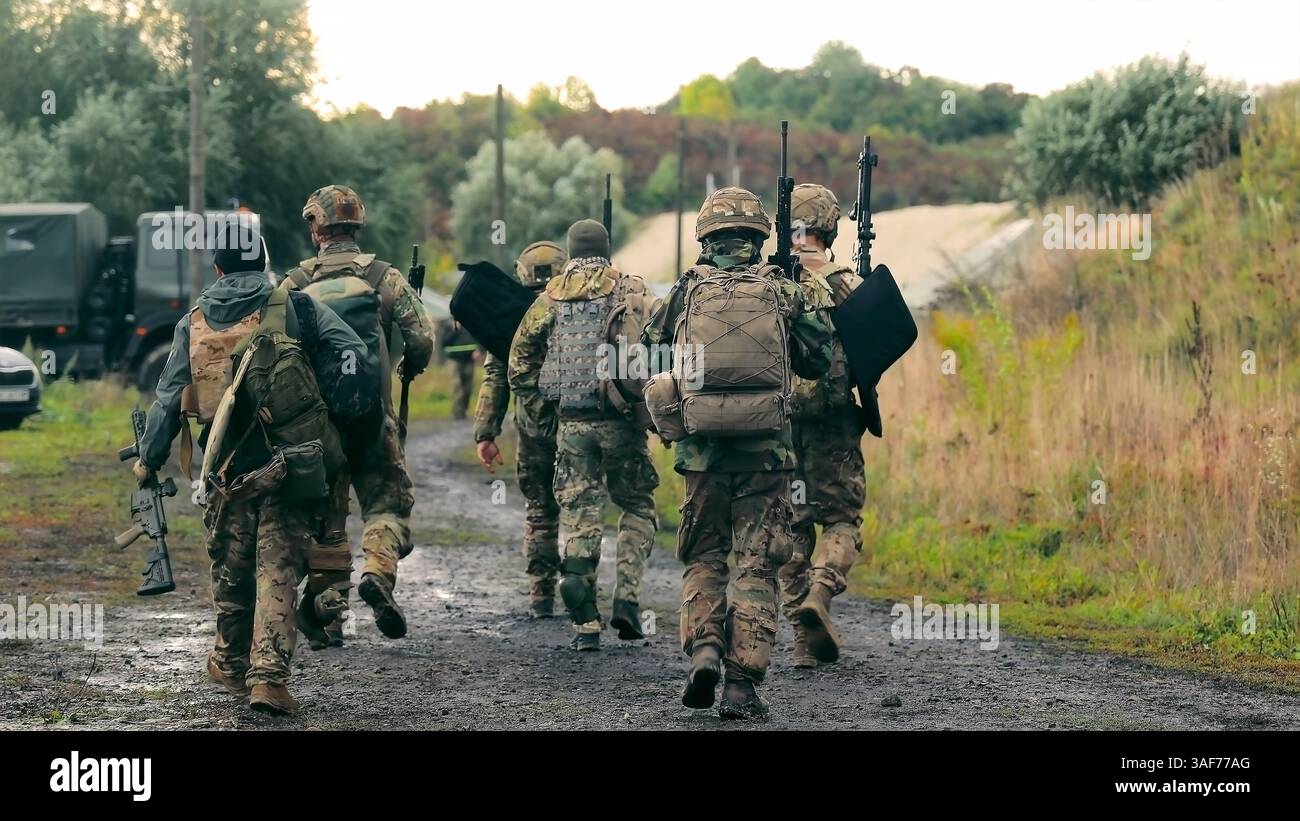 Soldiers marching in formation with military gear. Soldiers in military ...