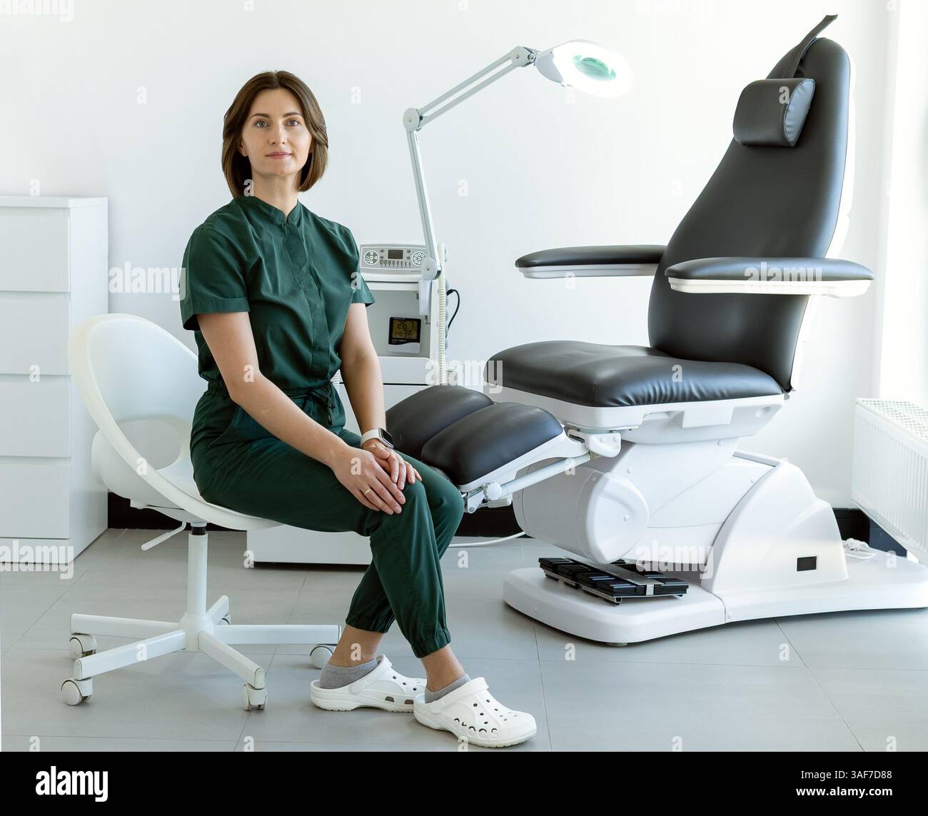 portrait of a female doctor cosmetologist in medical uniform in clinic ...