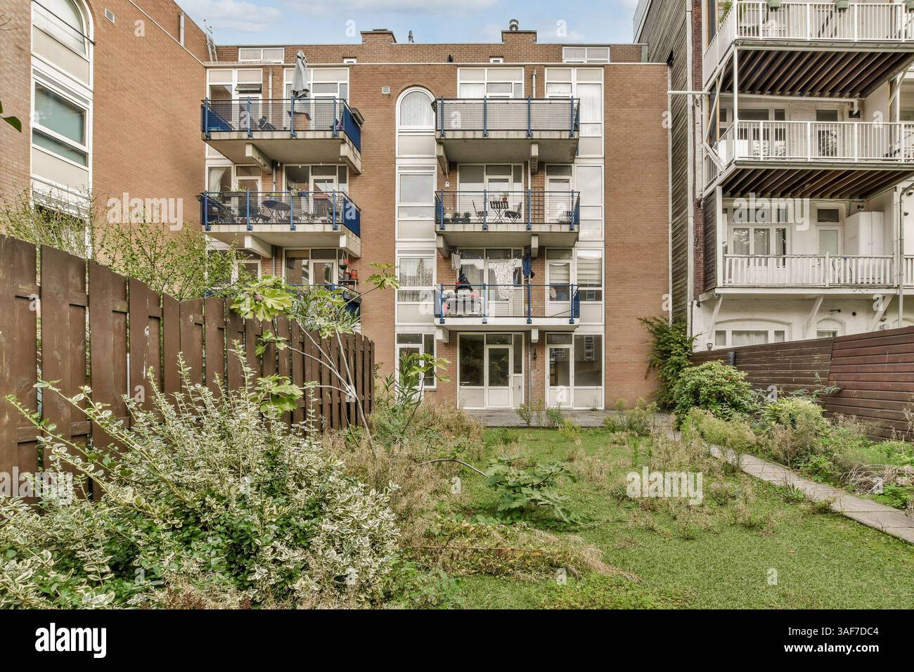 A well-maintained modern apartment complex featuring balconies and ...