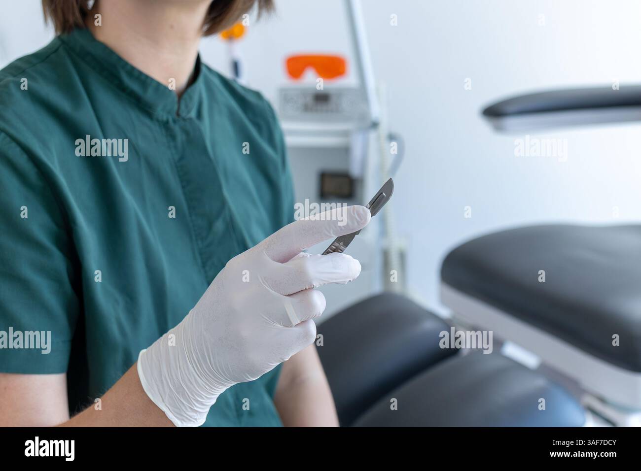 close up female doctor portrait holding scalpel, healthcare and ...