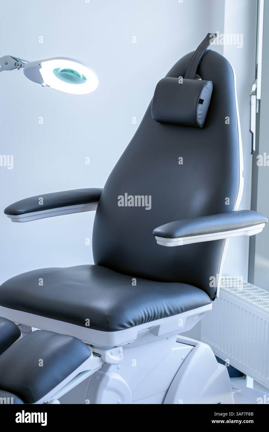 medical chair and lamp. room for receiving and examining patients ...