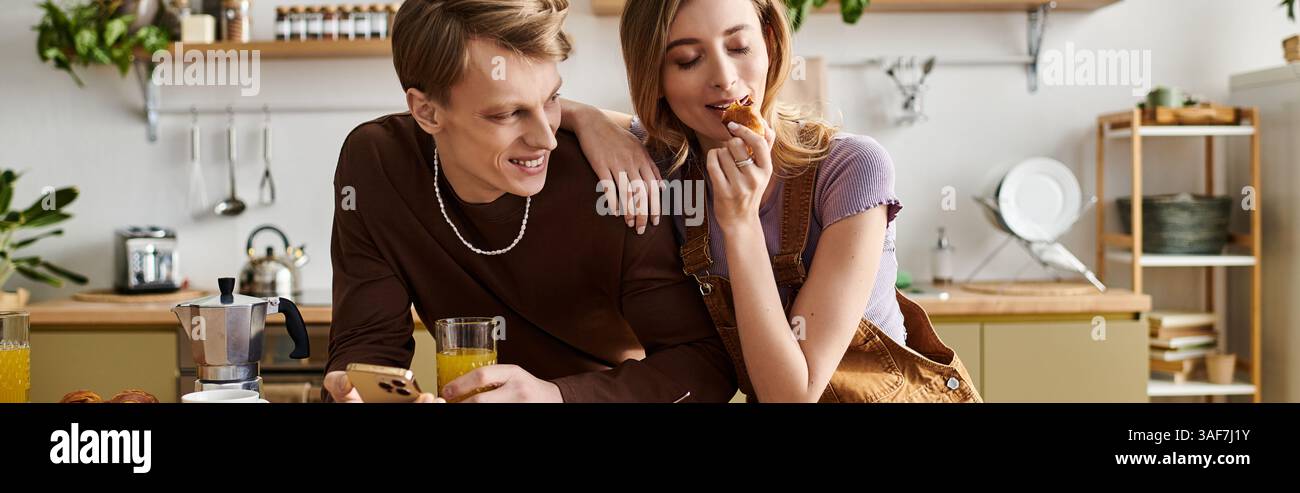 Loving couple shares snacks and drinks at home, creating a warm and ...