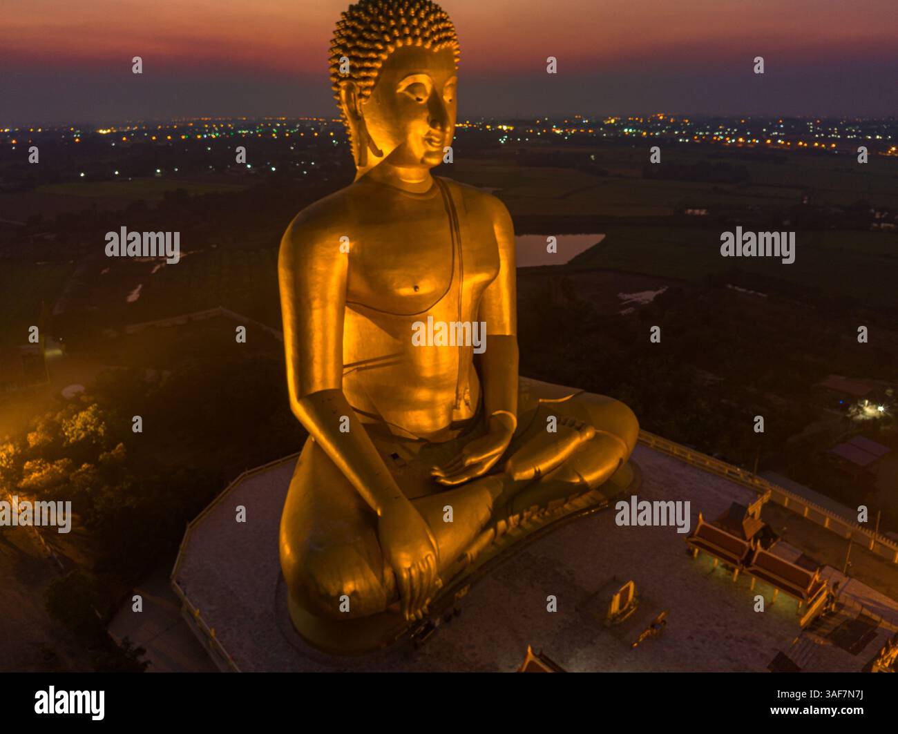 scenery sunset behind the great golden Buddha landmark of Thailand at ...