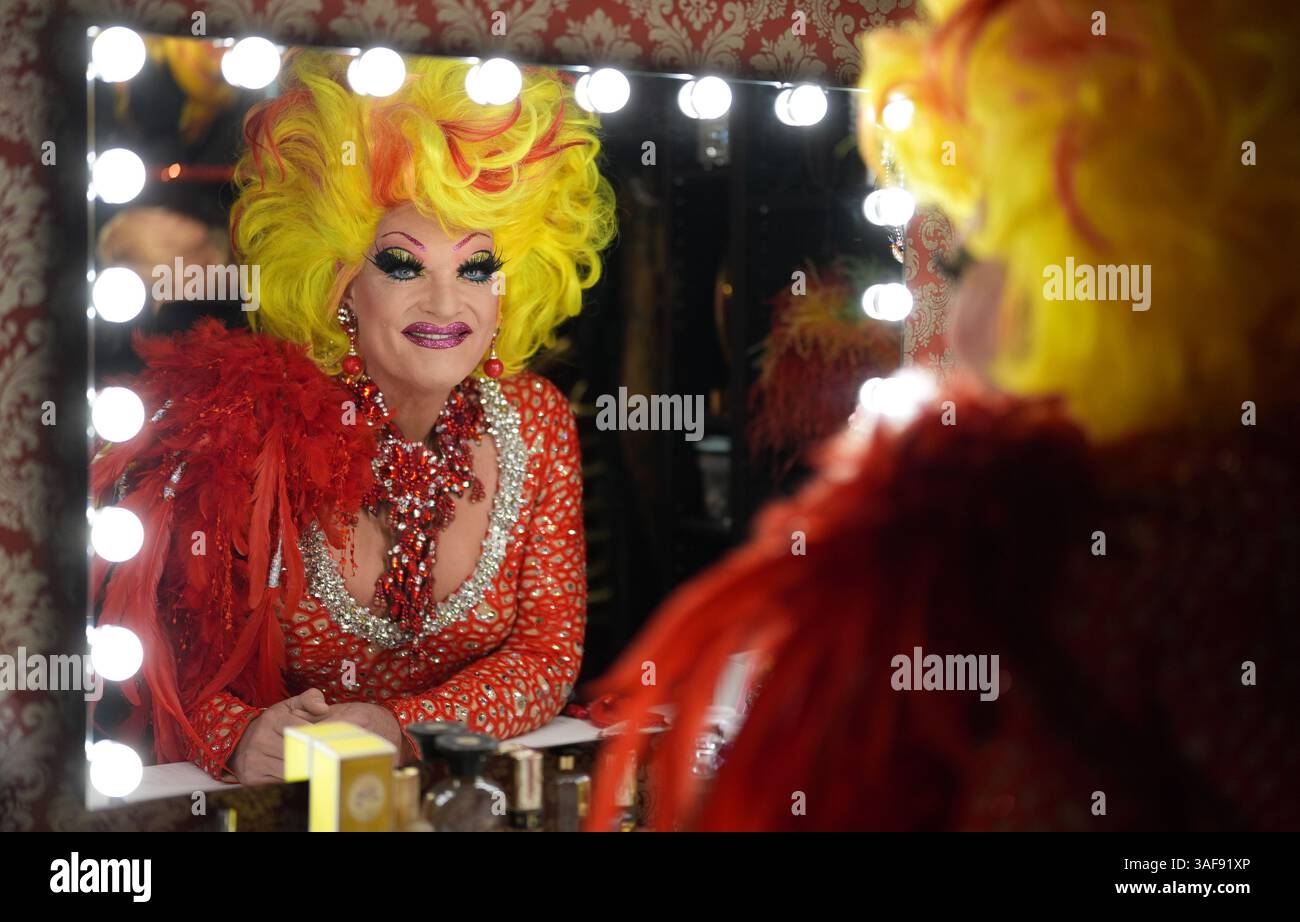 07 April 2025, Hamburg: Drag queen Olivia Jones sits in front of a make ...