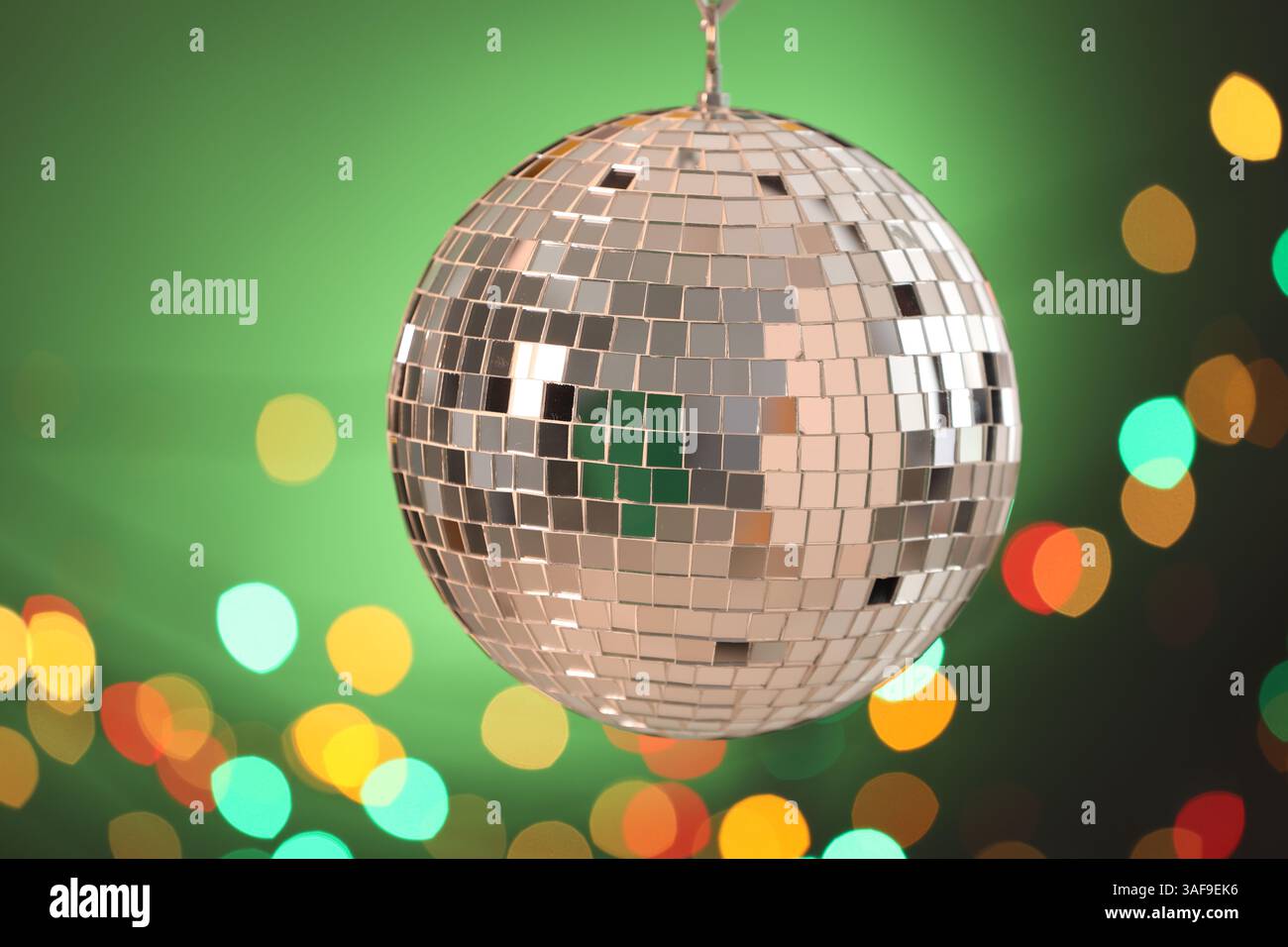 Shiny disco ball on color gradient background with blurred lights Stock ...