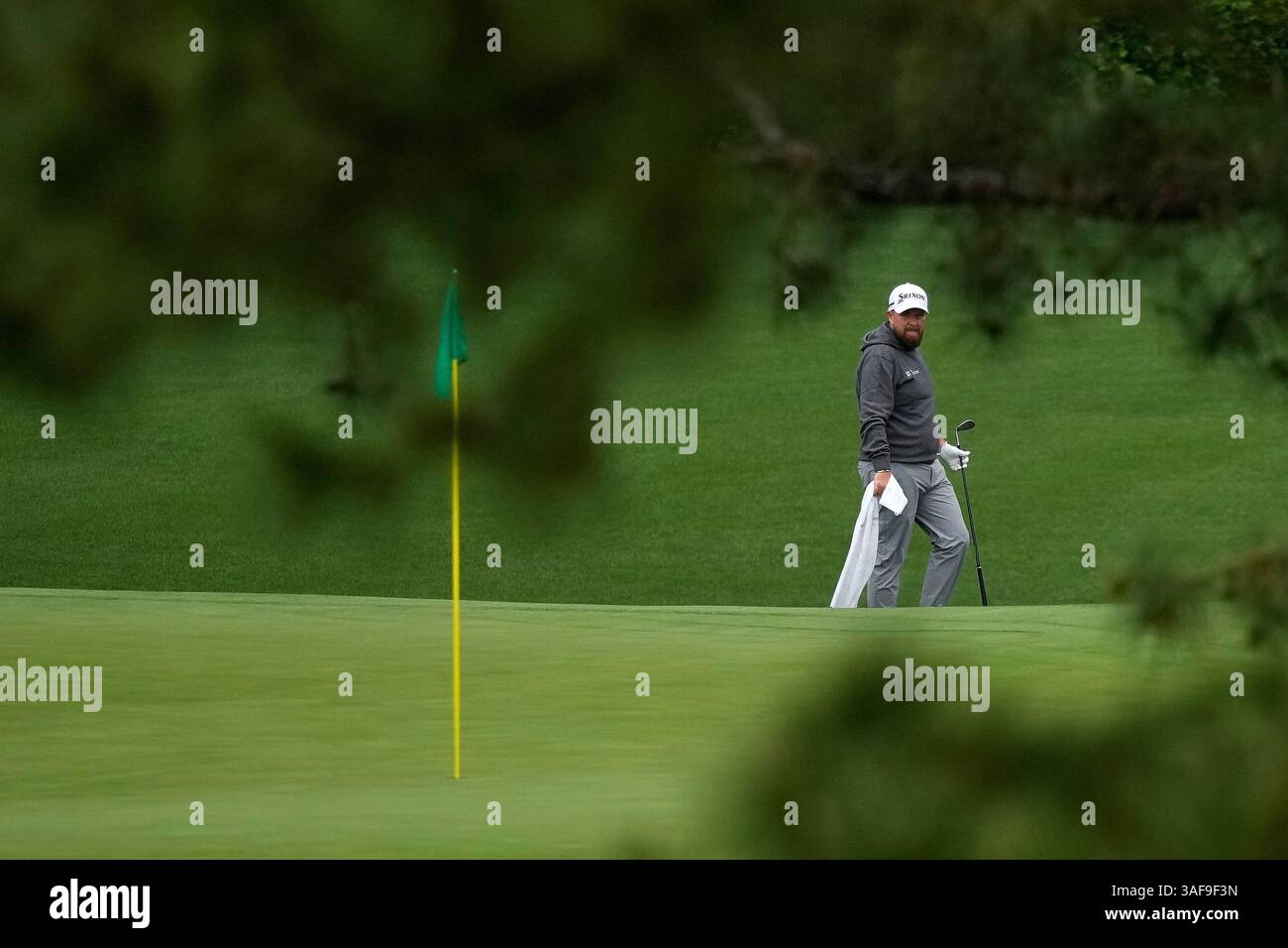 Shane Lowry, of Ireland, walks on the practice green during a practice ...