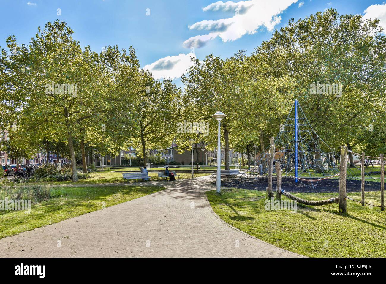 A tranquil park scene featuring a winding pathway surrounded by vibrant ...