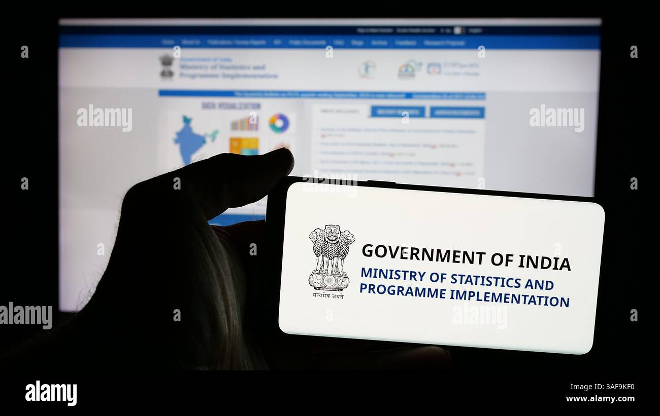 Stuttgart, Germany - 11-21-2024: Person holding mobile phone with logo ...