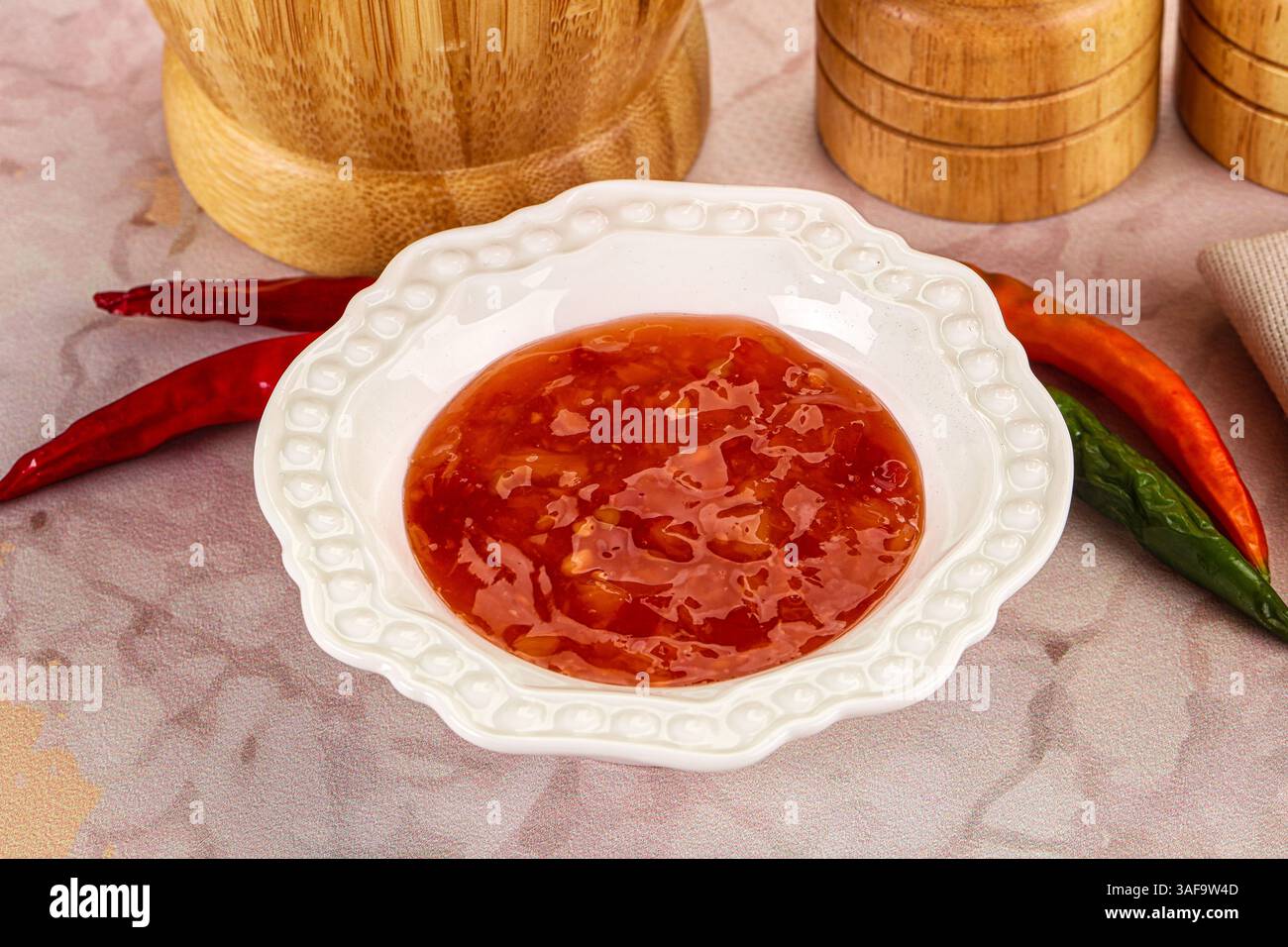 Sweet and sour chili sauce with pineapple pieces Stock Photo - Alamy