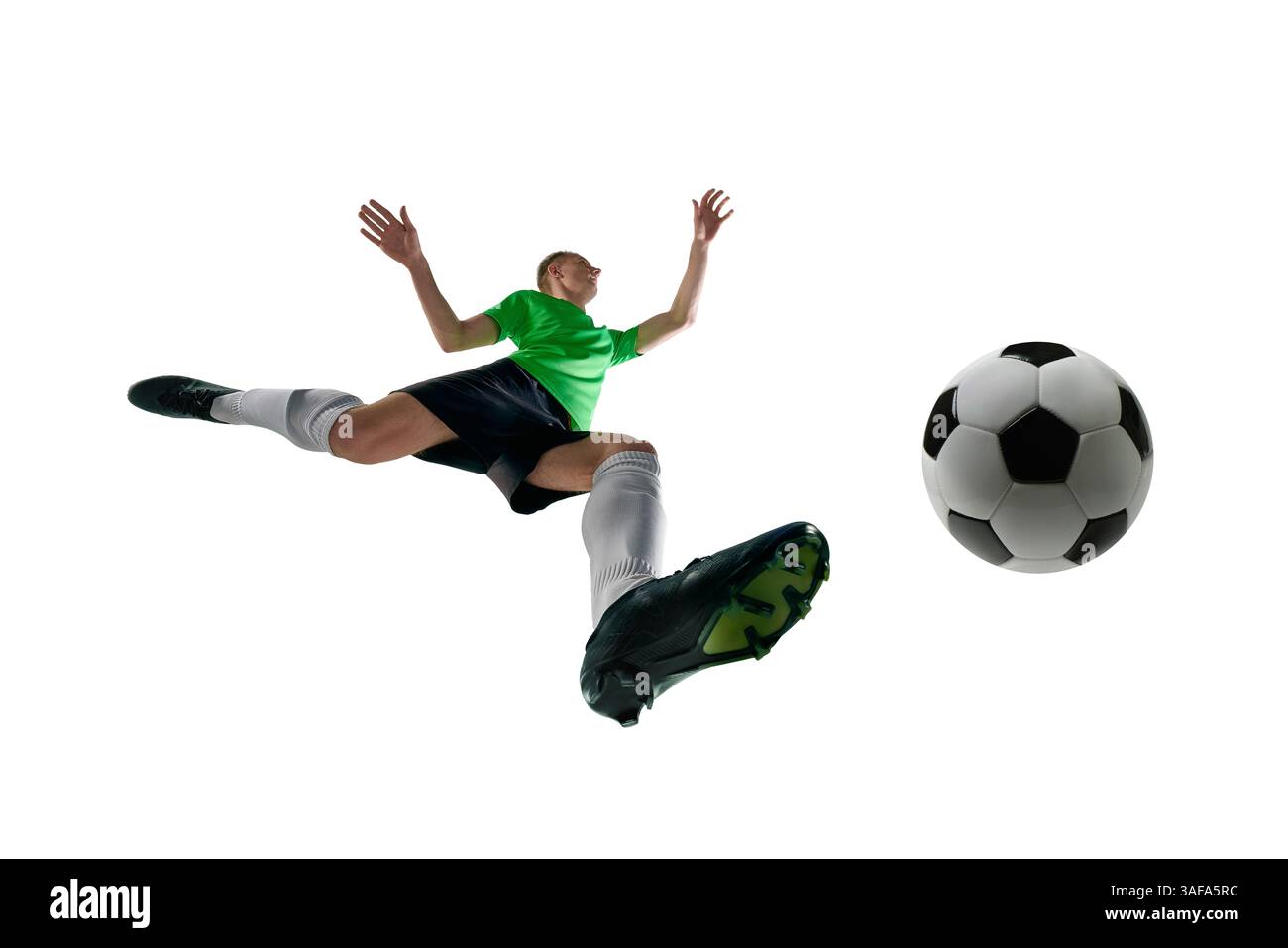 Low angle of male athlete, dressed sport uniform, soccer player leaping ...