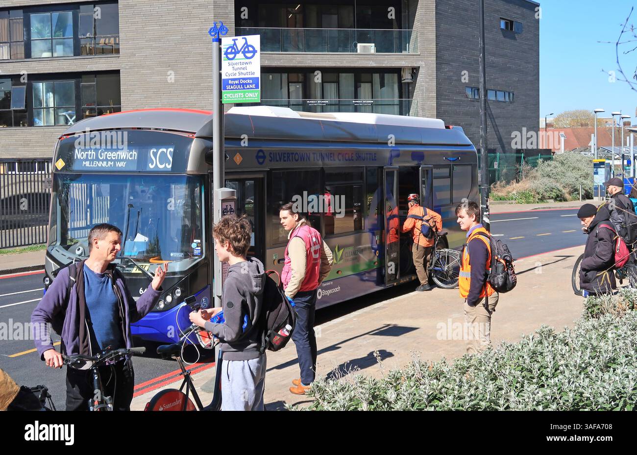 Cyclists using the new Silvertown Tunnel Shuttle Bus. Northern pick-up ...