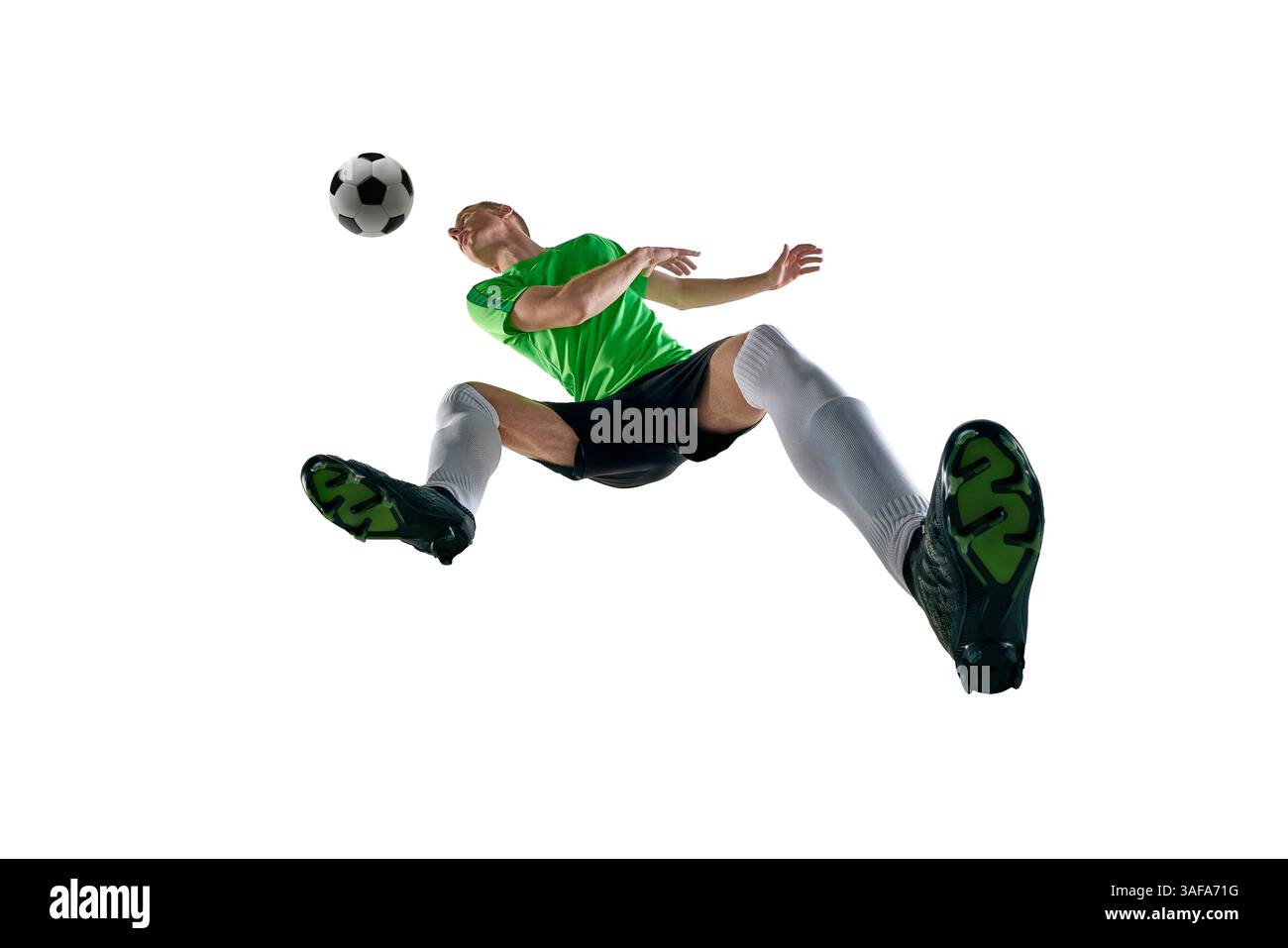 Low angle of male athlete, dressed sport uniform, soccer player jumping ...