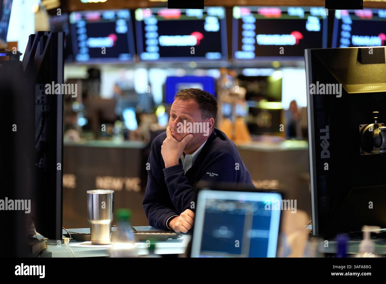 Traders work on the floor at the New York Stock Exchange in New York ...