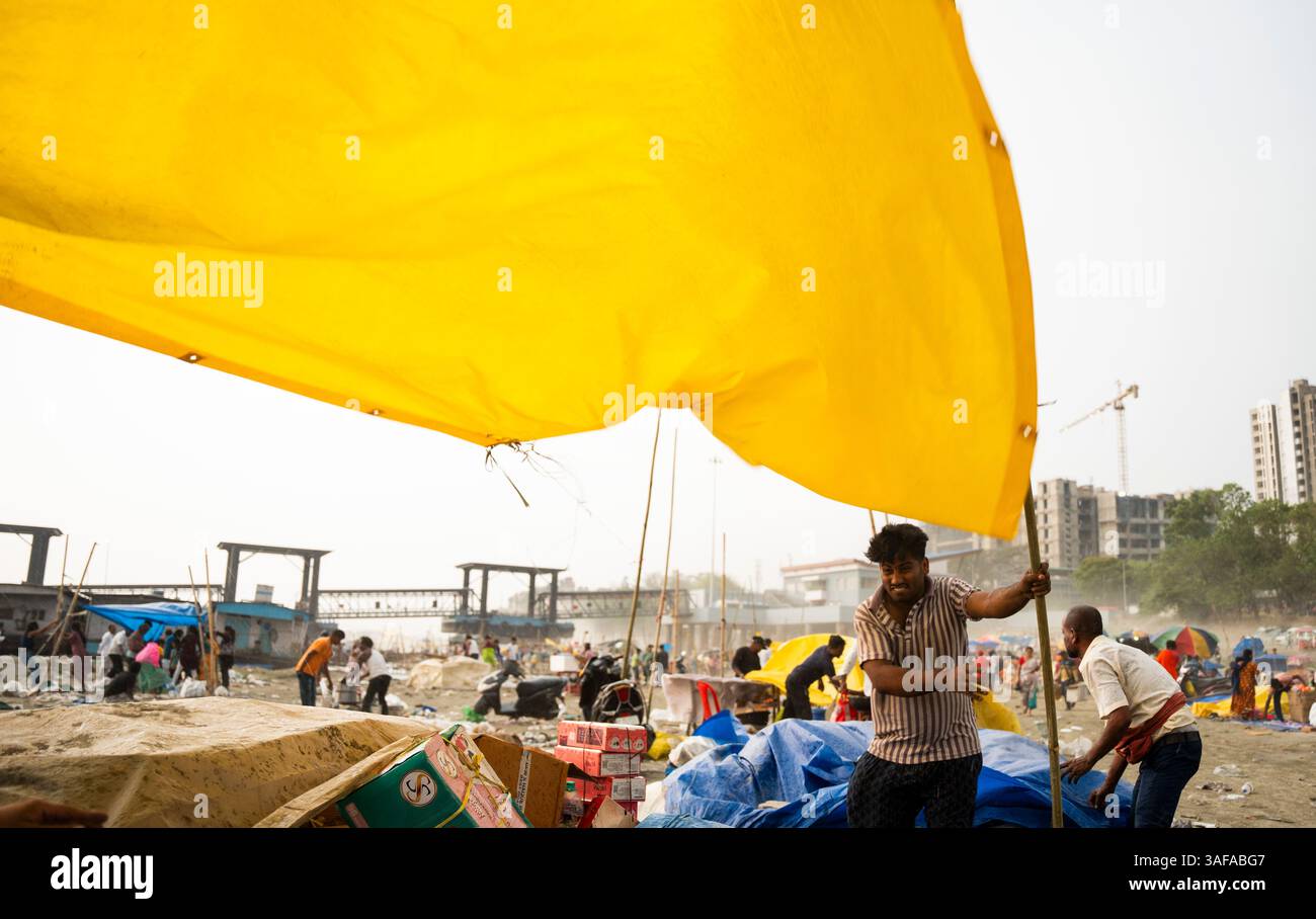 April 5, 2025: GUWAHATI, INDIA - APRIL 5: A vendor holds a plastic tarp ...