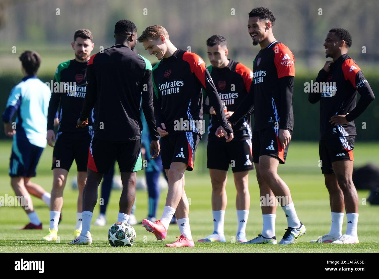 Arsenal's Martin Odegaard (centre) and William Saliba (centre right ...
