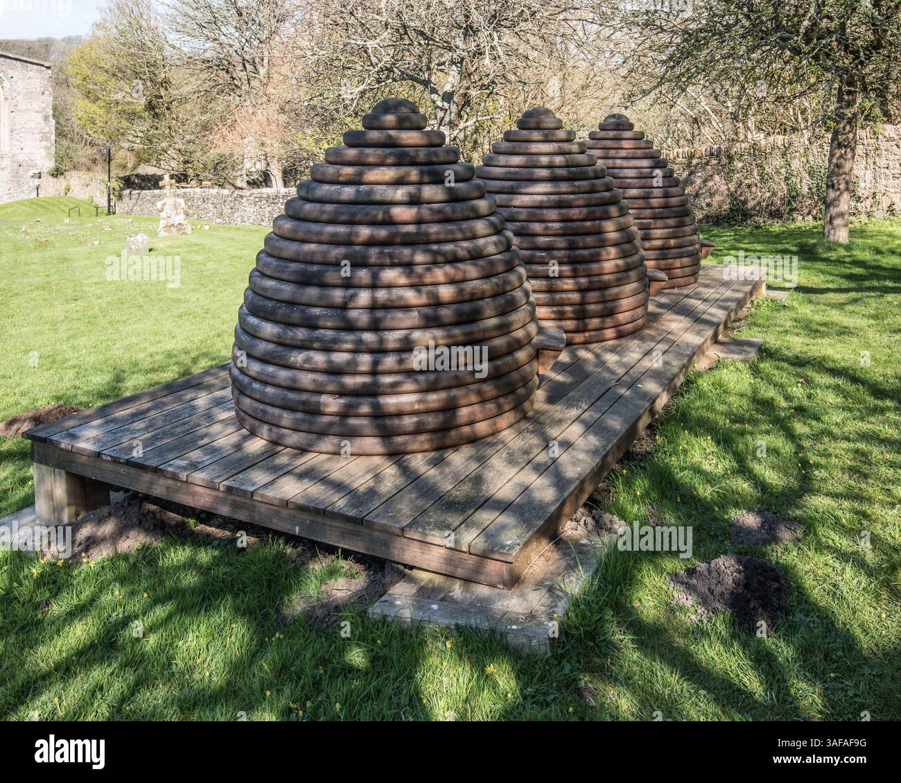 A series of three giant beehives to be seen at St Davids cathedral in ...
