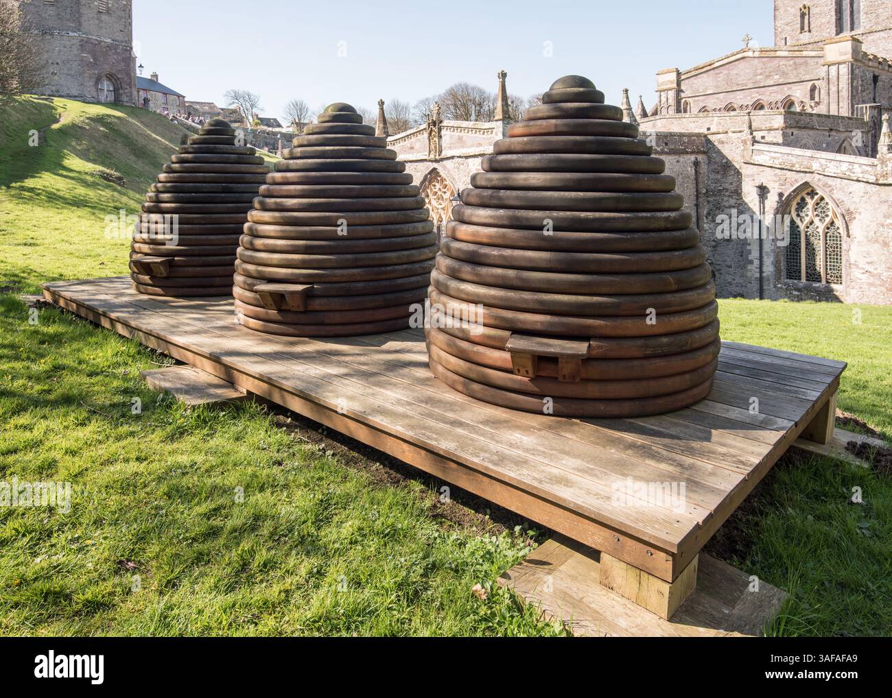 A series of three giant beehives to be seen at St Davids cathedral in ...