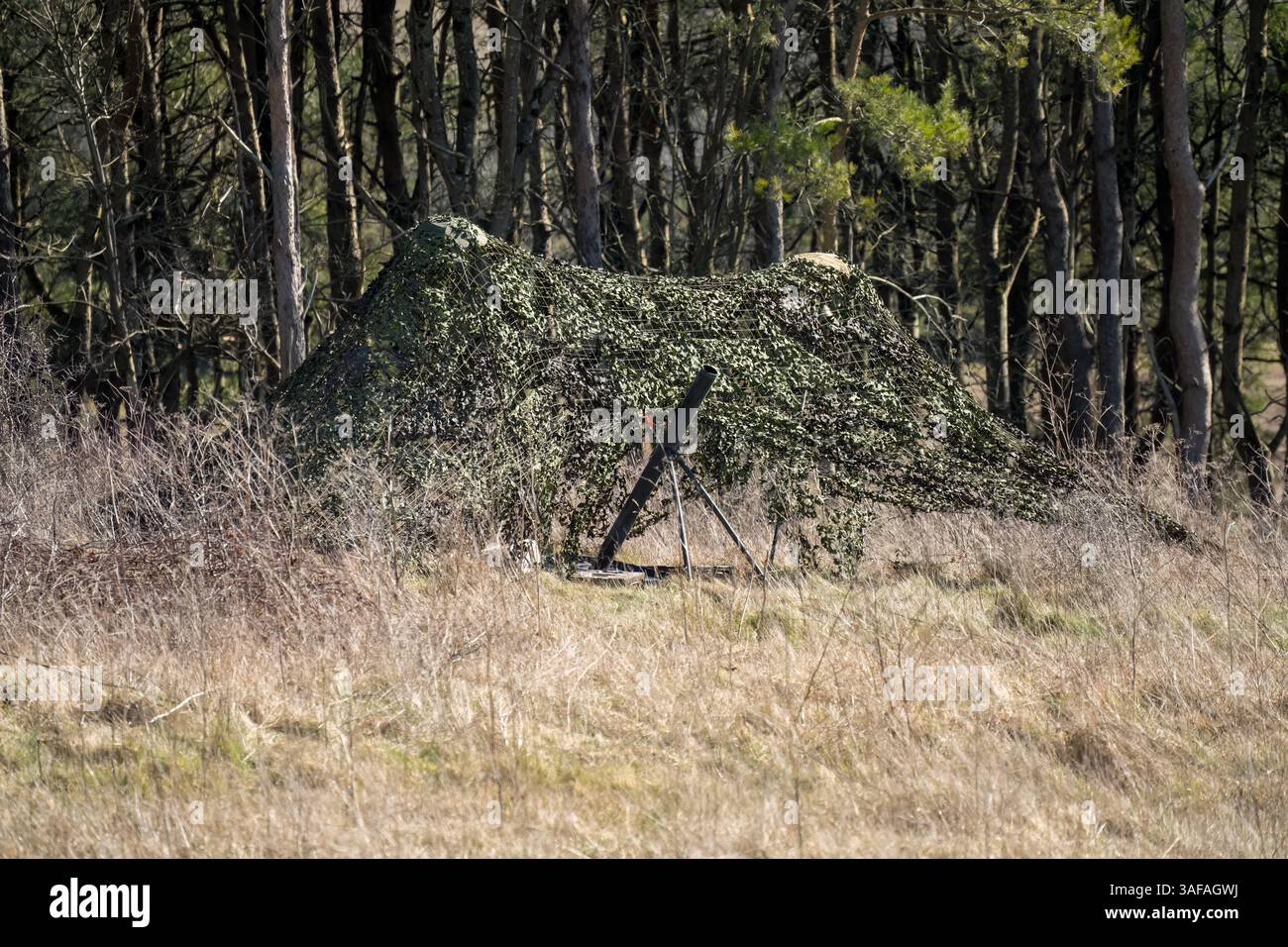 army camouflage netting cover deployed to hide broadcast equipment ...