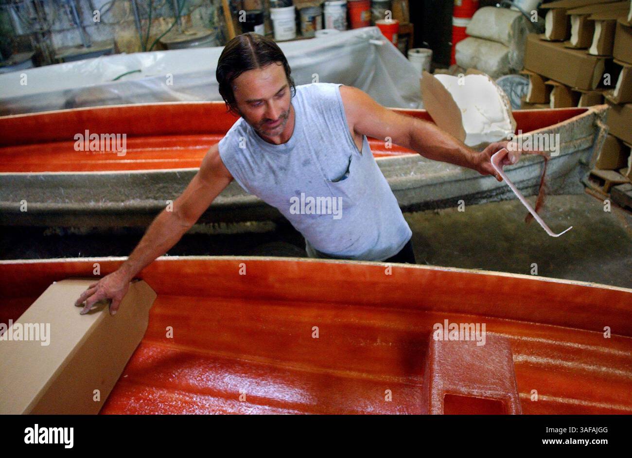 Jack Anthony (cq), of Titusville, fits the seats and bait well inside a ...