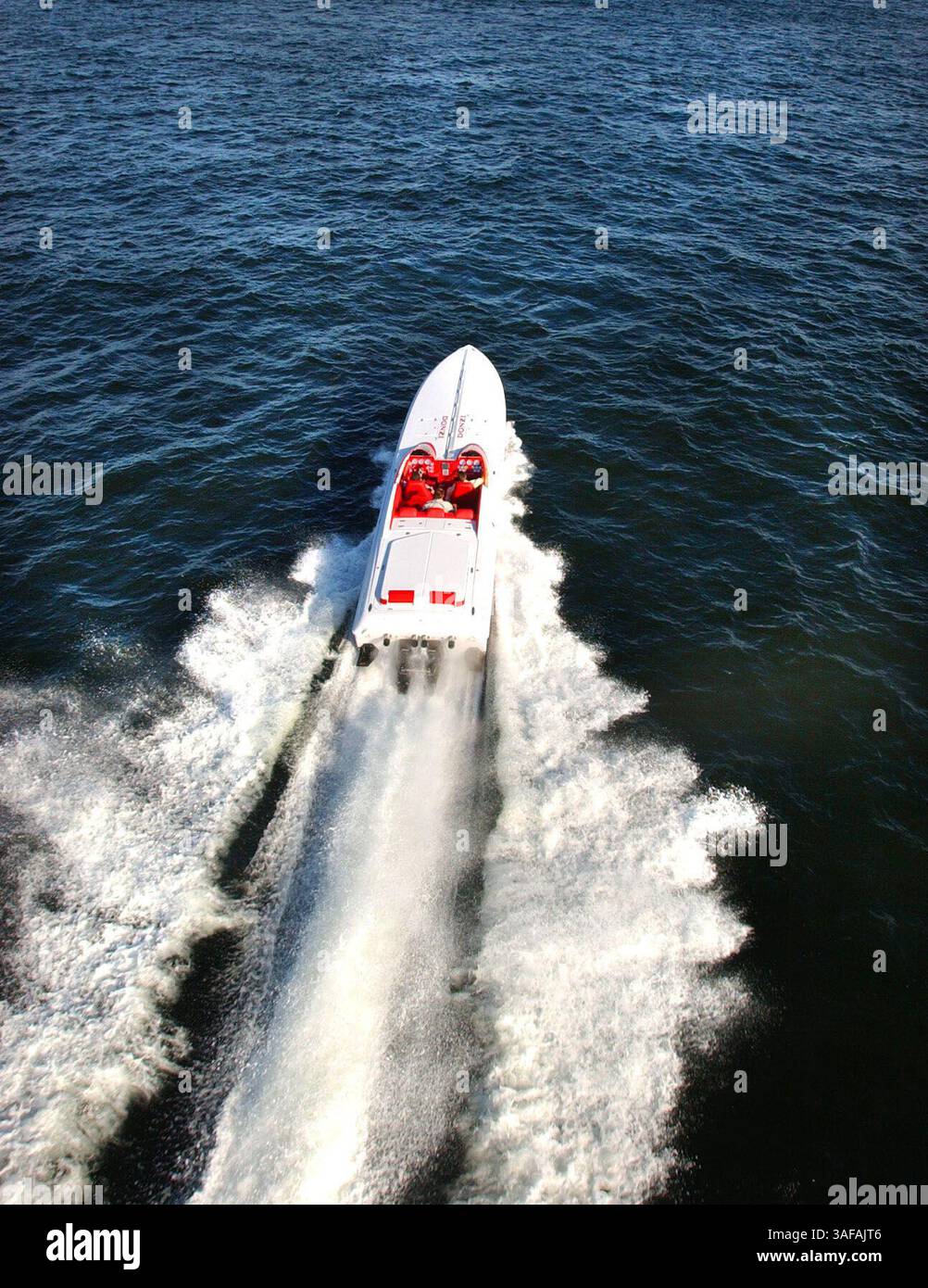 Photo # 12) A 38 foot Donzi ''go-fast'' boat cuts through the Gulf of ...