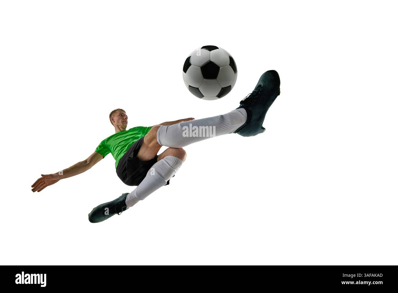 Low angle of focused man, dressed sport uniform, soccer player ...