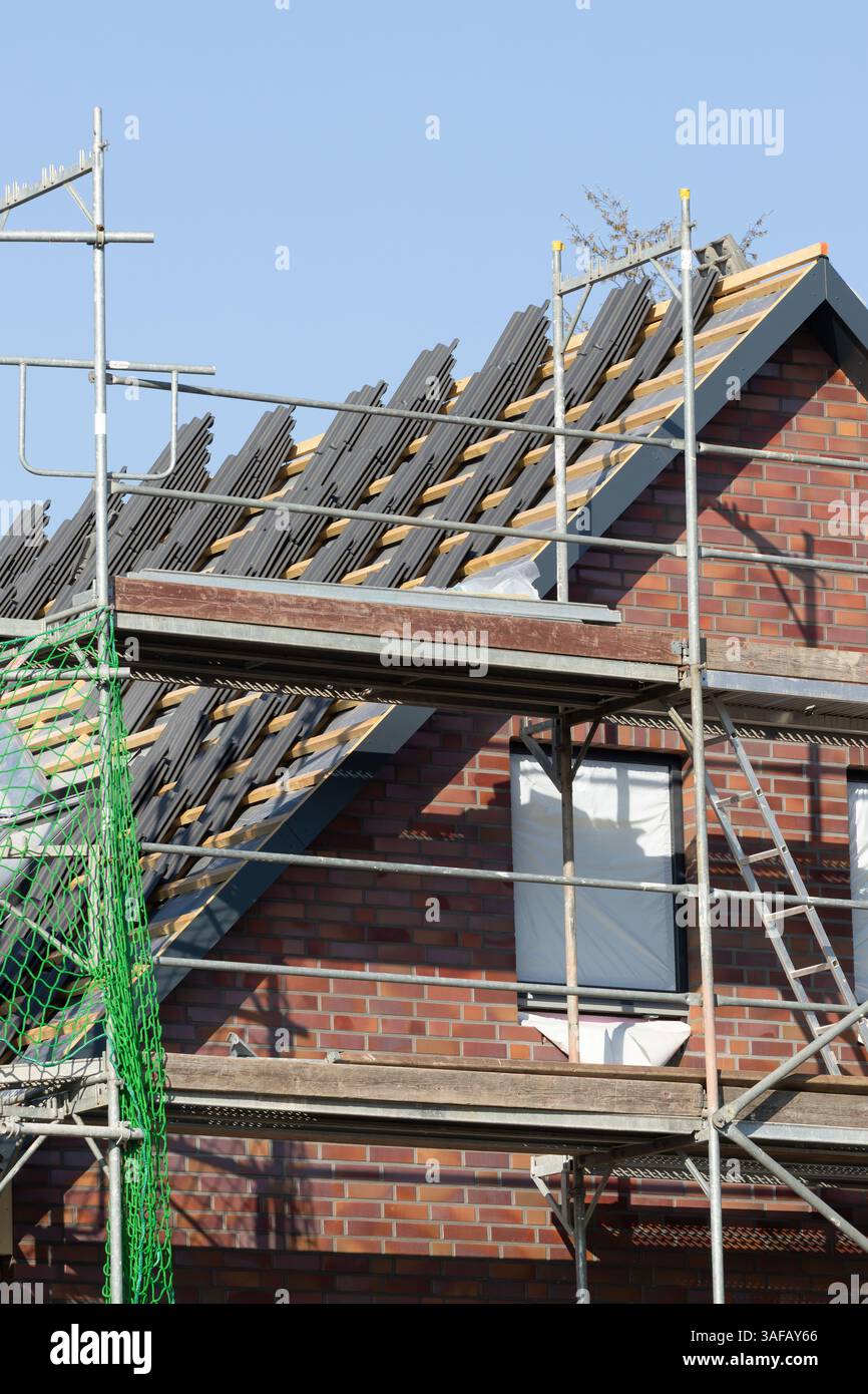 stack of black roof tiles on the roof battens Stock Photo - Alamy