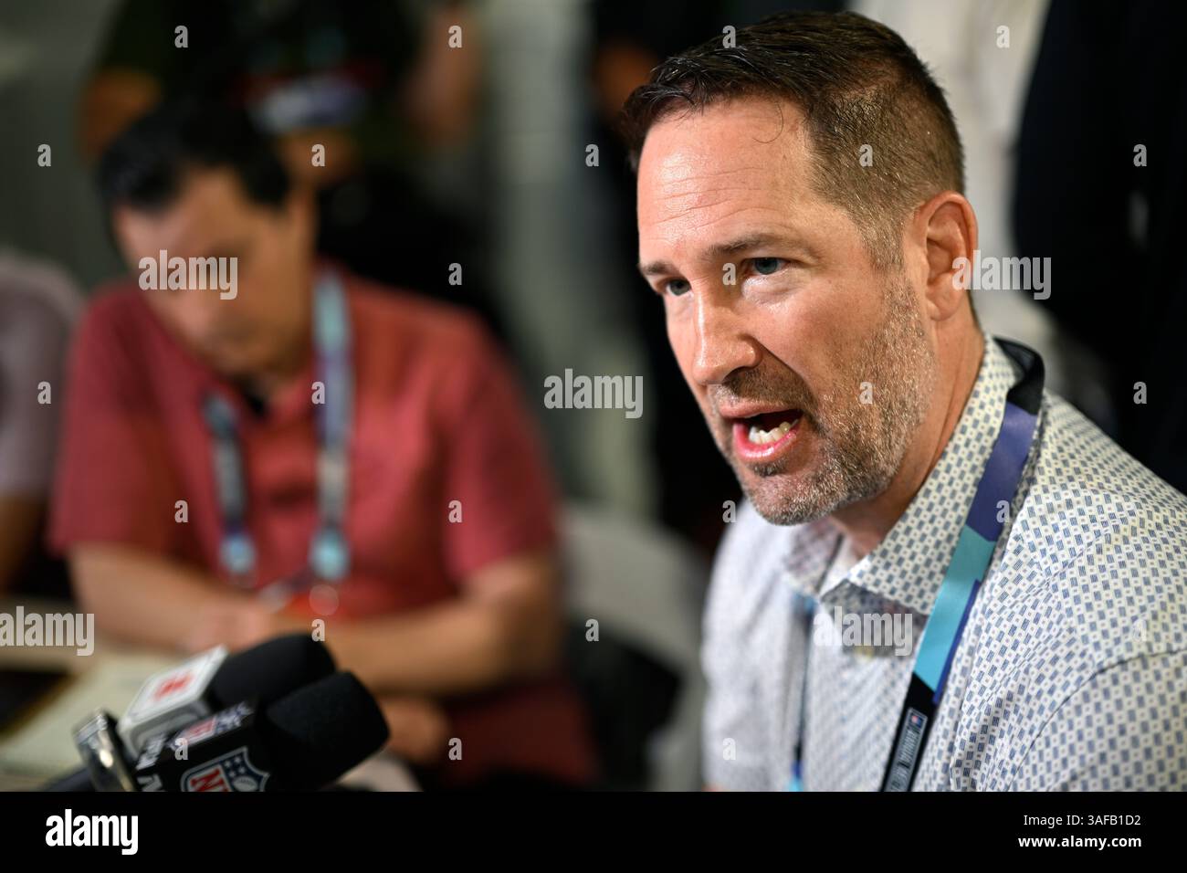 Dallas Cowboys head football coach Brian Schottenheimer, right, meets ...
