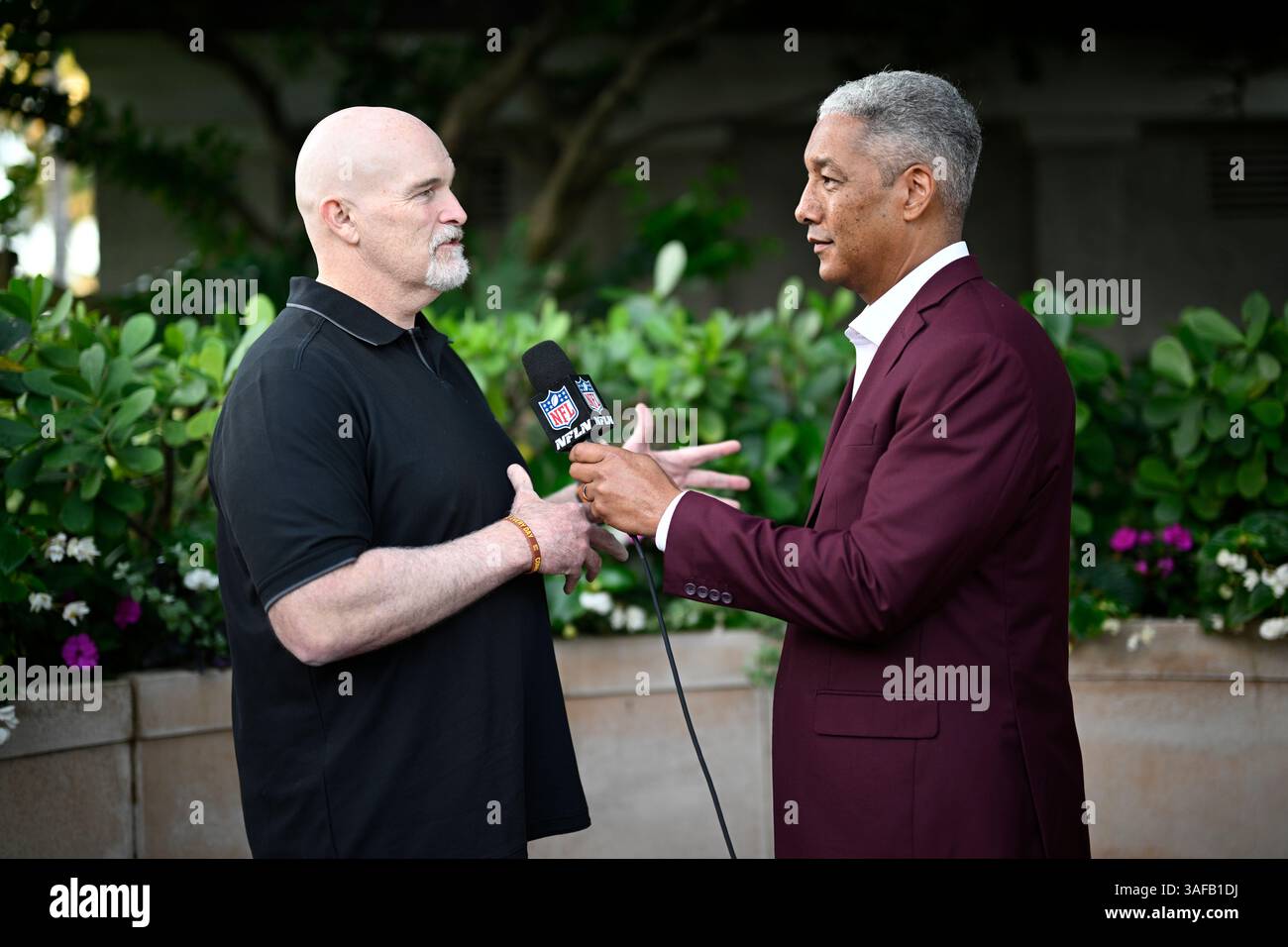 Washington Commanders head football coach Dan Quinn is interviewed by ...