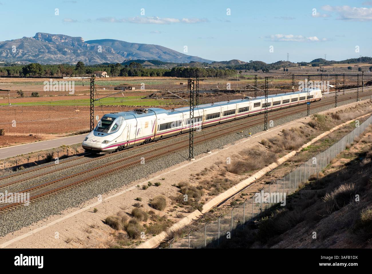 Renfe high speed train (AVE) in the countryside Stock Photo - Alamy
