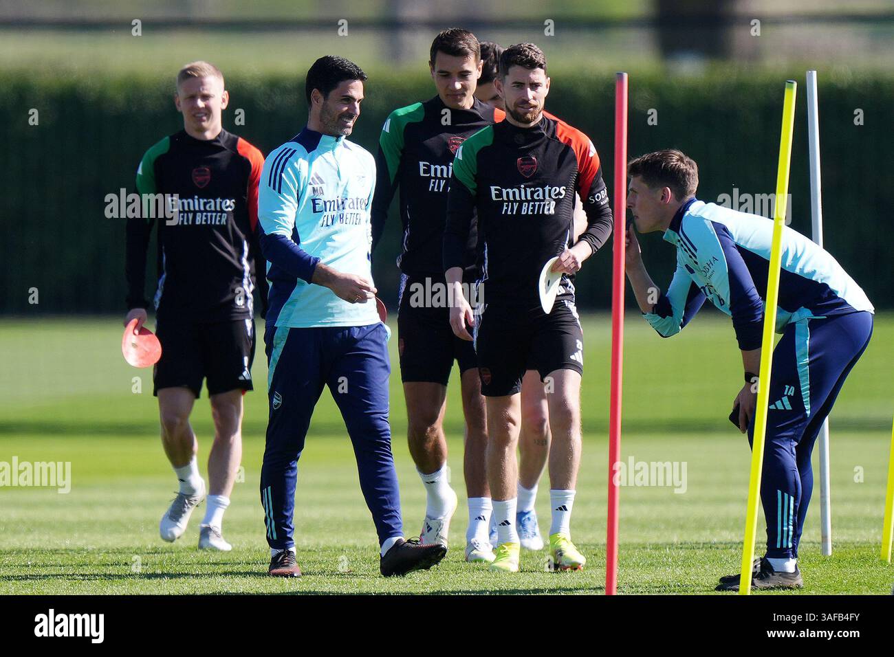Arsenal manager Mikel Arteta (centre left) and Jorginho (centre right ...