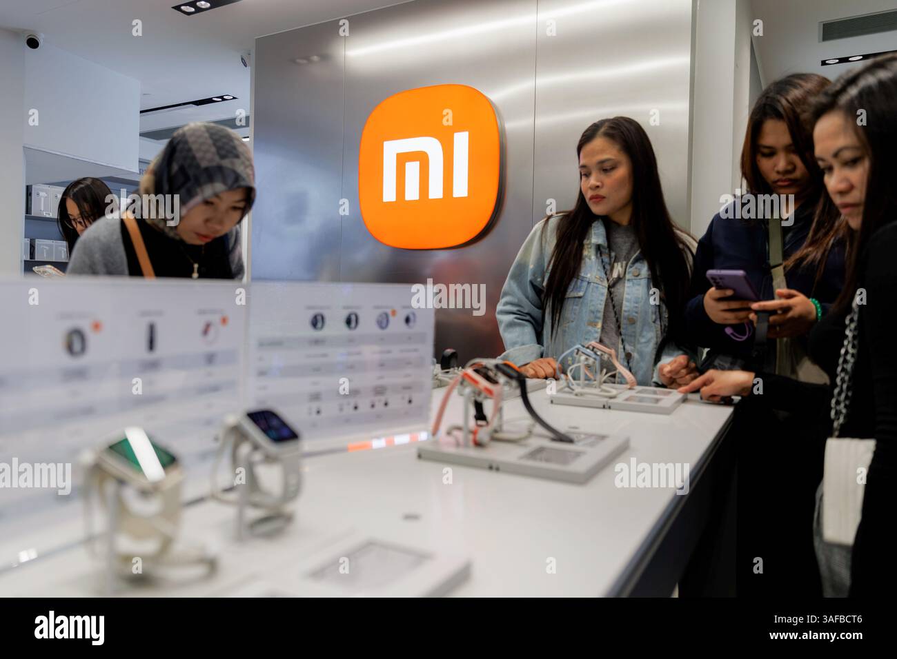 Hong Kong, China. 06th Apr, 2025. Customers inside Xiaomi's store. On April 6, which marks ...