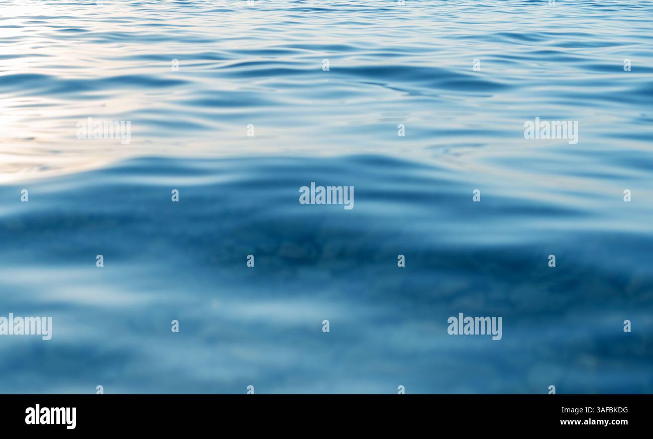 A soft and tranquil view of calm blue sea ripples under gentle light Stock Photo - Alamy
