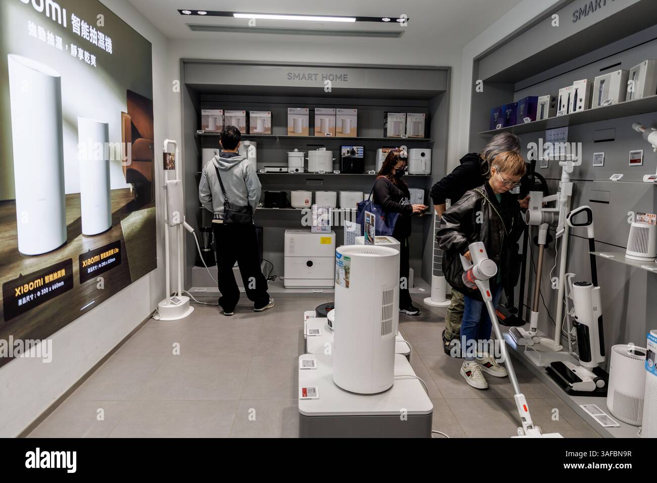 Hong Kong, China. 06th Apr, 2025. Customers inside Xiaomi's store. On April 6, which marks ...