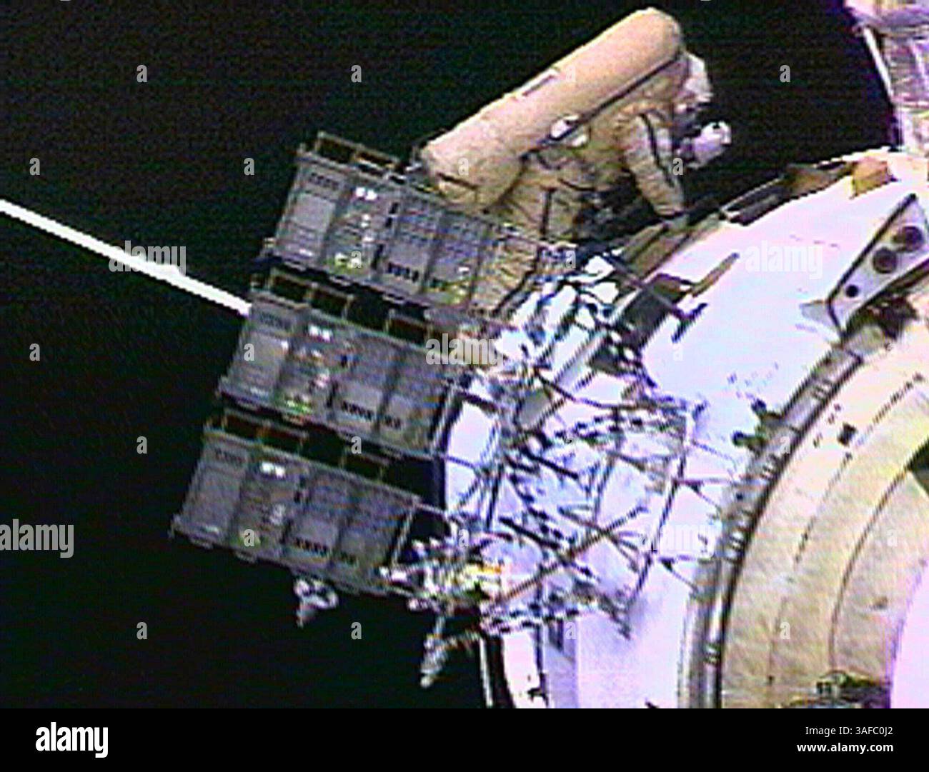 Dec 03, 2001; N/A, In Space; Cosmonaut Mikhail Tyurin takes pictures of ...